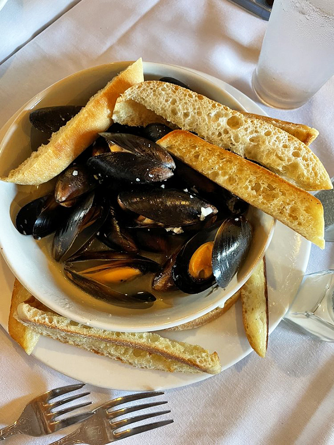 These mussels aren't just shellfish; they're tiny ocean treasure chests. Each one opens to reveal a briny-sweet surprise worth diving into headfirst.