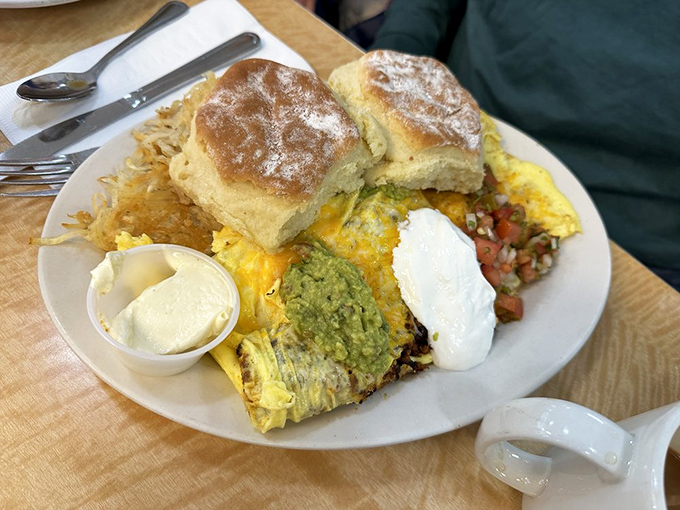 An omelet that's practically wearing a beret&mdash;sophisticated yet approachable. Those biscuits look so fluffy they might float away if not for the gravity of deliciousness.