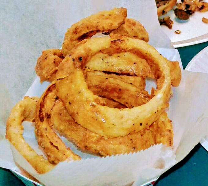 Golden hoops of happiness that make regular onion rings look like amateur hour. Crispy, substantial, and unapologetically homemade.