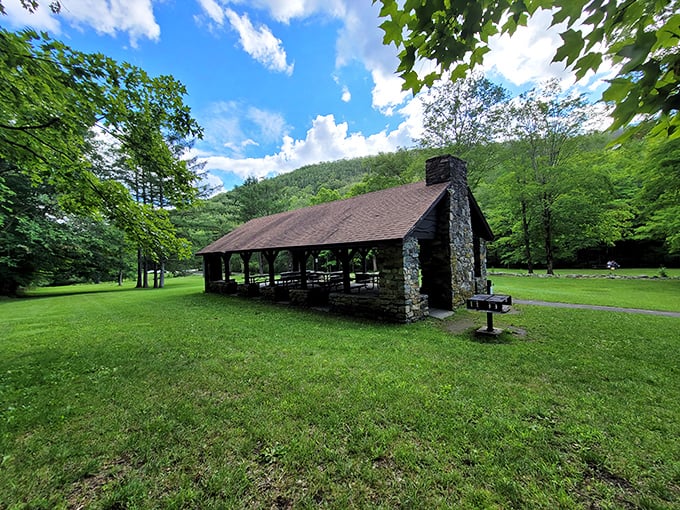 The stone picnic shelter stands ready for family gatherings, sudden downpours, and the inevitable "I forgot the napkins" moments.