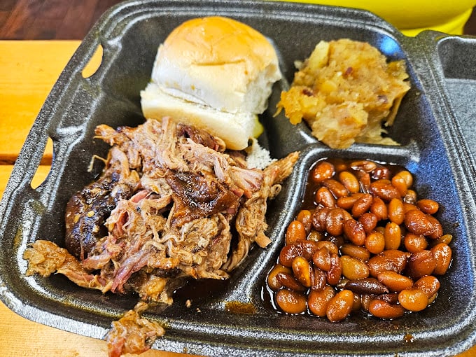 Pulled pork, baked beans, and a roll&mdash;the barbecue equivalent of a perfect three-piece suit, tailored for your taste buds.
