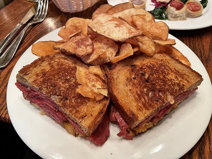 The Reuben sandwich: where corned beef meets melted Gruy&egrave;re in a dance so beautiful it deserves its own Connecticut state holiday. House chips included for applause.