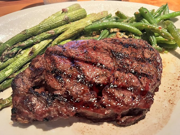 This ribeye isn't just cooked&mdash;it's been sweet-talked to perfection, with asparagus and green beans standing by as worthy companions.