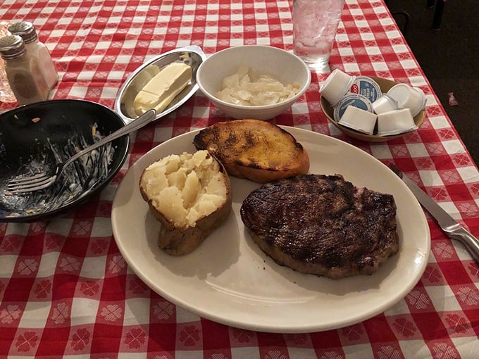 Simplicity sings on this plate. A butter-topped baked potato and golden Texas toast complement the star of the show.