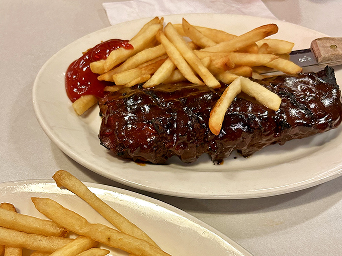 These ribs don't just fall off the bone &ndash; they practically leap into your mouth. The sauce-to-meat ratio is what barbecue dreams are made of.