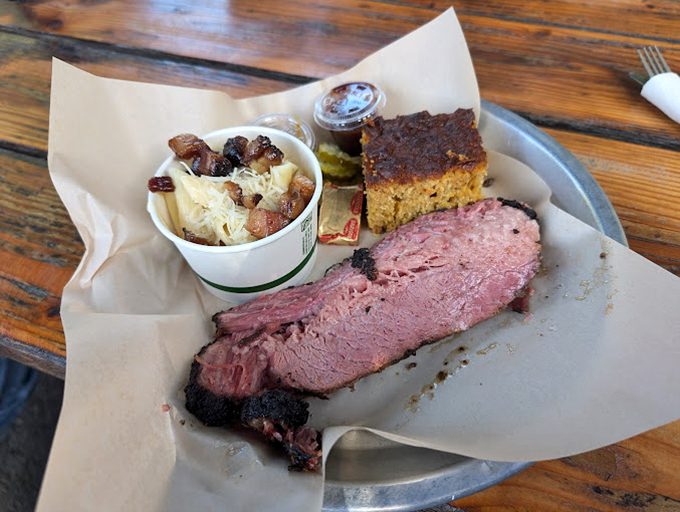 Brisket with that telltale pink smoke ring that barbecue aficionados chase like bird watchers after a rare sighting. Served on butcher paper&mdash;as it should be.