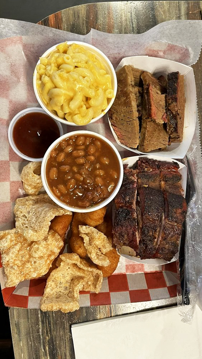 This isn't just a meal, it's a flavor expedition &ndash; mac and cheese, baked beans, and meat with the kind of smoke ring that deserves its own championship belt.