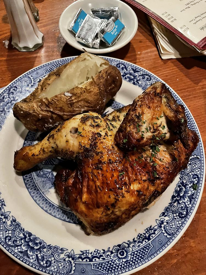 Spit-roasted chicken that's traveled through fire to reach flavor nirvana, paired with a baked potato that's having its own delicious identity crisis.