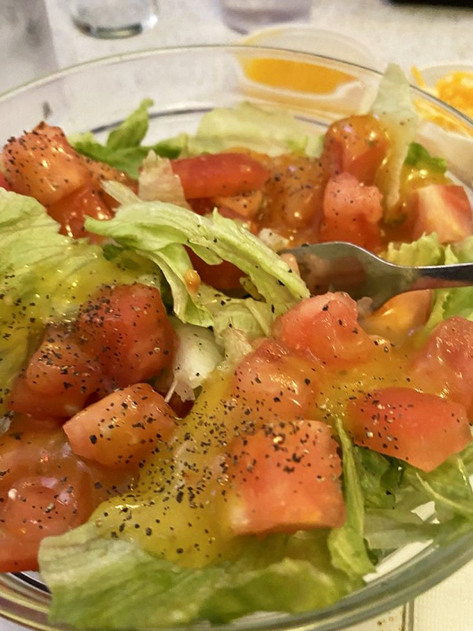 Even the salad looks nostalgic, dressed in that golden vinaigrette your grandmother would approve of. Vegetables as supporting actors to the bacon main event.