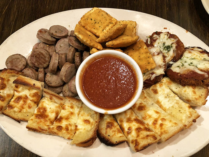 The sampler platter&mdash;where indecision becomes a virtue. Garlic toast, sausage, and cheese unite in a United Nations of appetizer diplomacy.