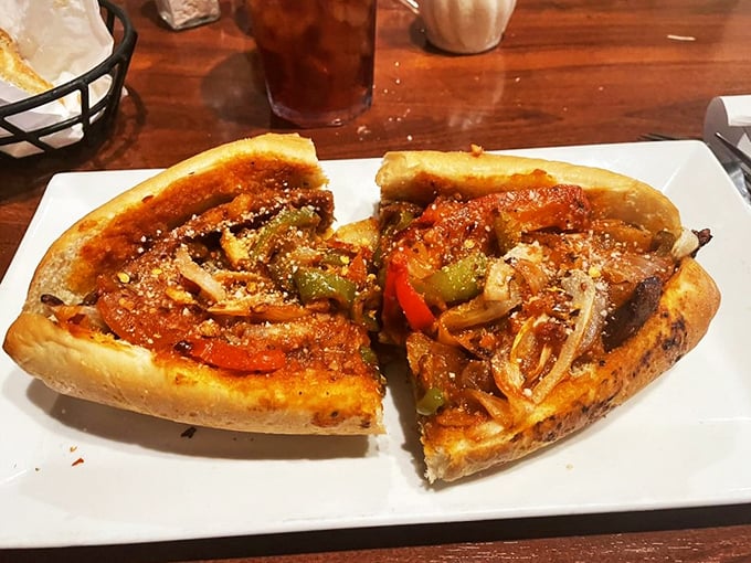 This isn't just a sandwich; it's an architectural marvel of flavors. The peppers and onions are having the time of their lives.