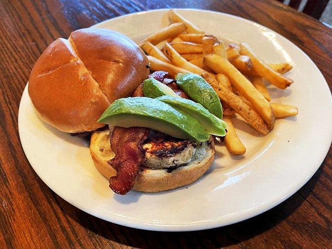 This isn't just a burger&mdash;it's architecture. The avocado adds that California touch to a Midwestern classic, while those fries stand at attention.