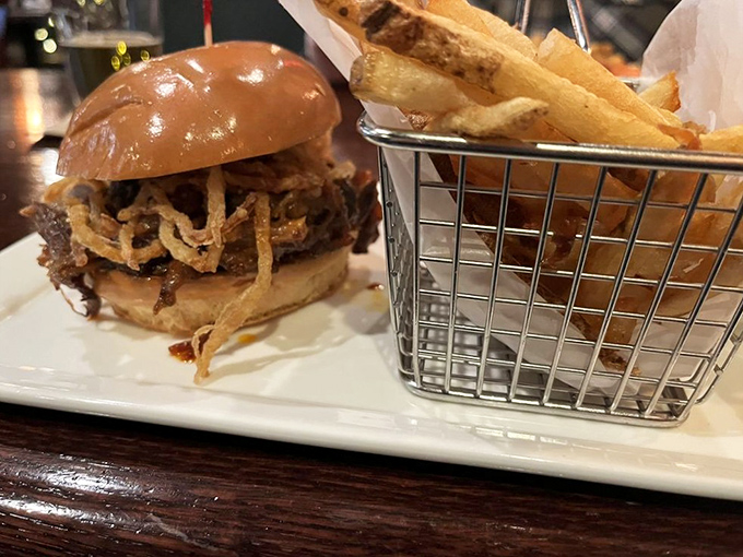 This isn't just a burger, it's architecture &ndash; a towering creation of beef, crispy toppings, and what appears to be the secret to happiness in sandwich form.