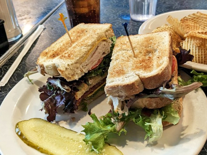 Club sandwiches stacked taller than a Missouri oak tree. Those toothpicks aren't decoration—they're structural engineering at its finest.