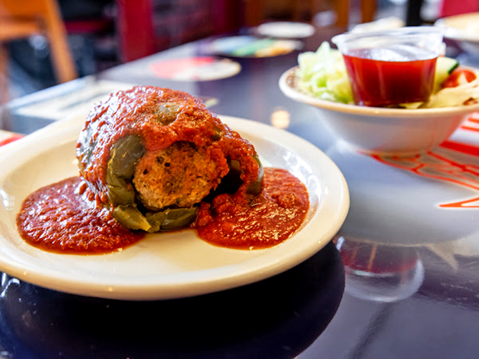 Not all heroes wear capes; some come wrapped in green peppers, stuffed with savory filling, and bathed in marinara magnificence.