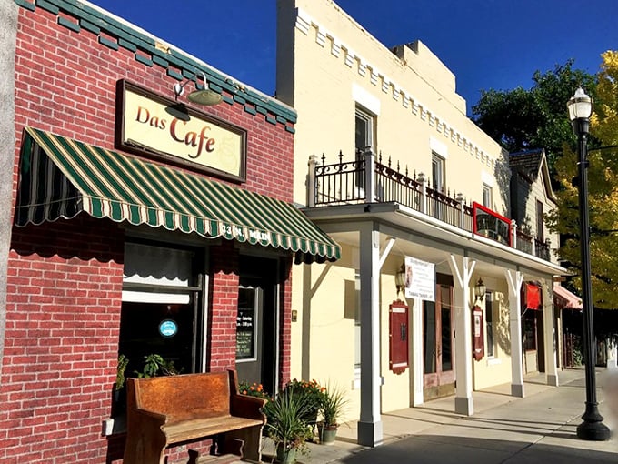 Main Street's historic storefronts, with their classic awnings and wooden bench, create the perfect backdrop for both commerce and conversation.