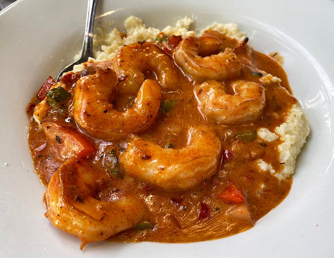 Gulf shrimp lounging in a creamy sea of perfectly executed grits - a Southern breakfast classic that demands to be savored slowly.