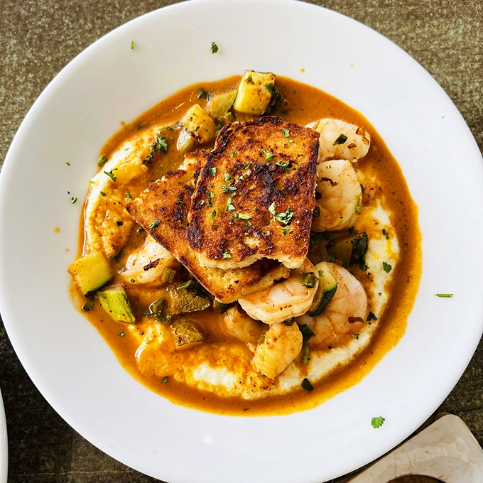 Shrimp and grits so good you'll consider moving to Virginia Beach. The sauce alone deserves its own Instagram account.