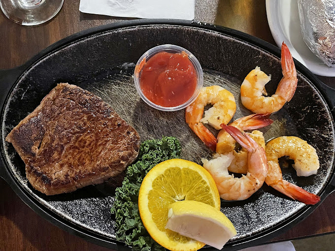 The ocean and pasture collide in delicious harmony on this sizzling skillet, where neither steak nor shrimp is willing to play second fiddle.