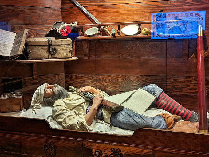 Life at sea wasn't all swashbuckling adventure. This lifelike display shows the cramped quarters where pirates spent most of their days.