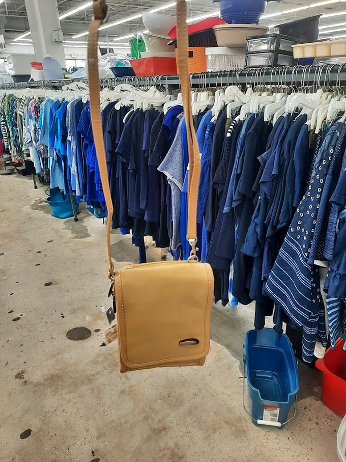 The "SHOES" sign looms like a beacon of hope for footwear enthusiasts. From practical flats to statement heels, this aisle is a podiatrist's fever dream.