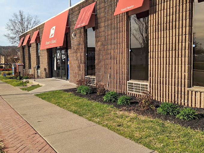 Heart and Hand Outreach: "Red awnings, warm hearts! This brick-front treasure trove turns shopping into an act of community kindness."