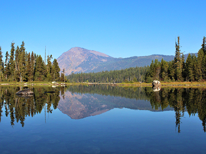 Mirror-perfect reflections make this alpine lake nature's version of a two-for-one special on mountain scenery.