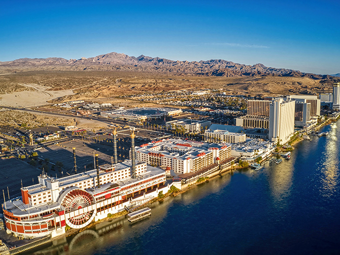 Laughlin's riverside casino resorts sparkle against the desert landscape like mirages that decided to stick around permanently.