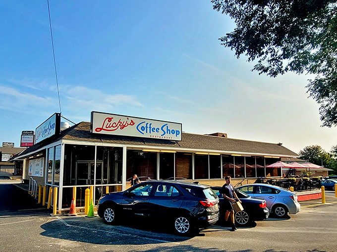 Lucky's Coffee Shop's classic diner profile stands proudly against the blue sky &ndash; a monument to breakfast done right.
