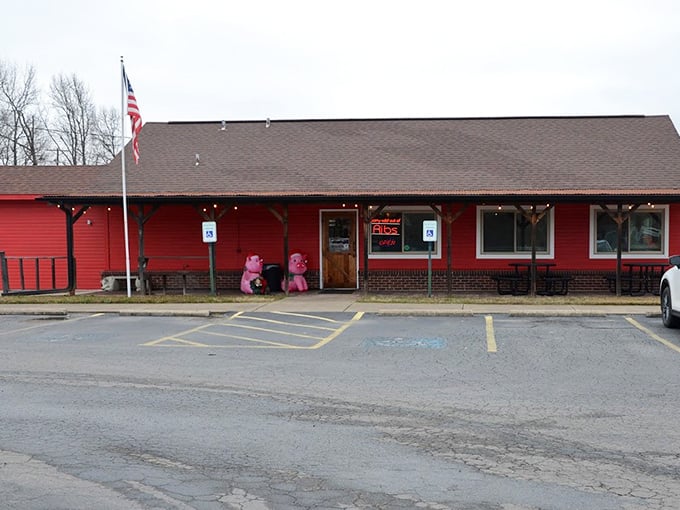 Mean Pig's red building and American flag create the perfect barbecue backdrop. Simple, patriotic, and mouth-watering.