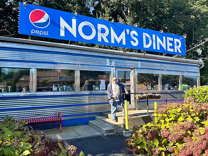 Norm's blue trim and chrome shine like a culinary beacon, promising morning salvation in the form of perfect eggs.
