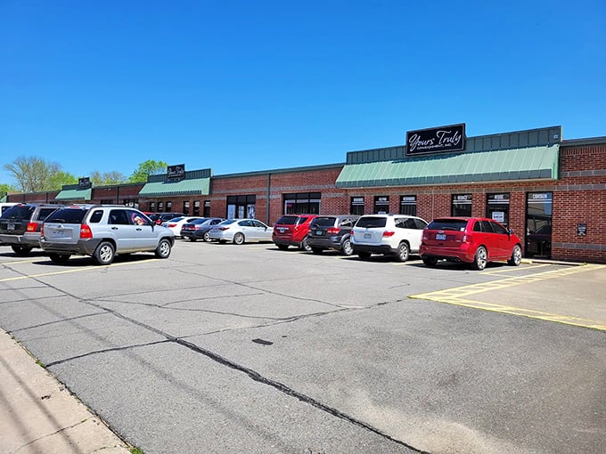 Yours Truly's brick facade and green awnings invite shoppers to discover consignment treasures within.
