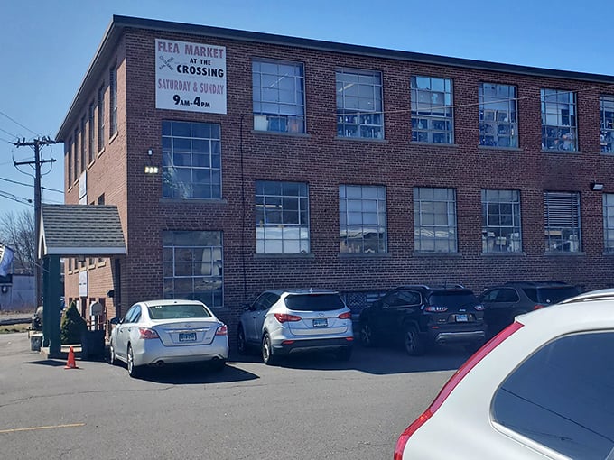 Flea Market at the Crossing announces itself proudly. Behind those brick walls, generations of treasures await new homes.