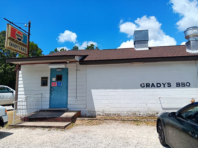 That blue door at Grady's isn't just an entrance&mdash;it's a portal to a world where barbecue is still cooked the way your grandparents remember.