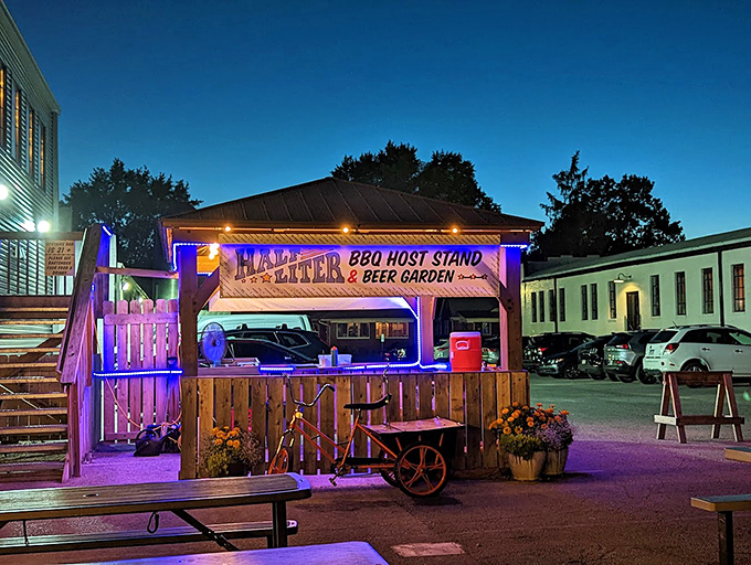 This beer garden setup at Half Liter is where BBQ dreams and summer afternoons become perfect memories.