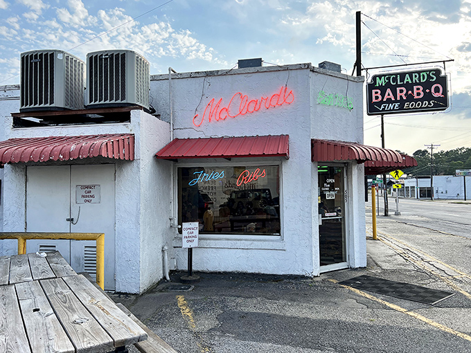 Those neon signs aren't just decoration—they're beacons guiding BBQ pilgrims to smoky, saucy nirvana.