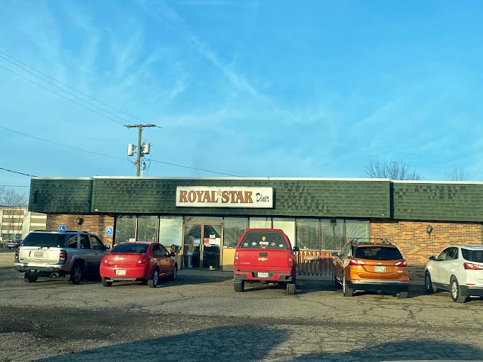 Royal Star Diner: Morning light reveals a no-nonsense diner where the coffee's always hot and the breakfast platters make fast food drive-thrus weep with inadequacy.