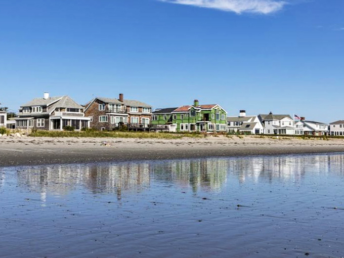 Morning light dances across Rye's shoreline, where beach houses line up for the best views of nature's masterpiece.