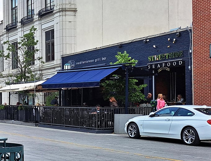 The sidewalk seating isn't just convenient – it's front-row tickets to Birmingham's street theater with seafood as the star.