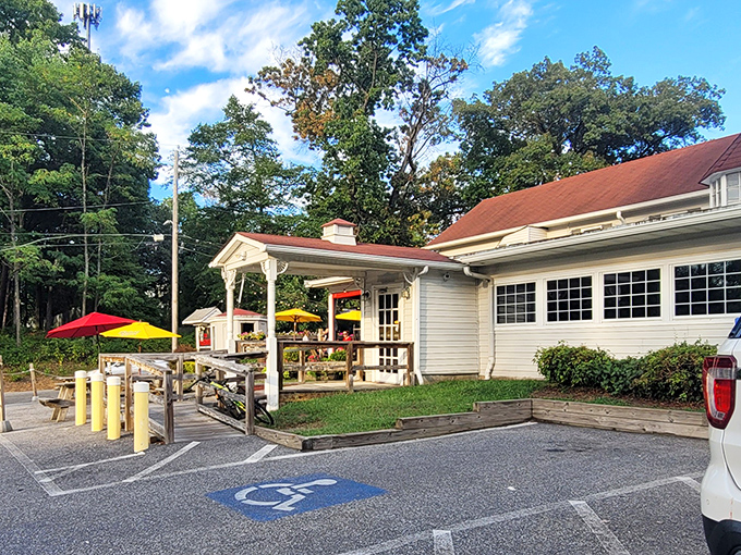 Picnic tables and primary-colored umbrellas create a casual vibe at The Hideaway&mdash;where burger simplicity reaches its highest form.