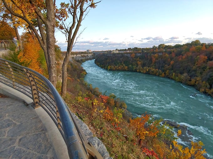 Fall turns this churning gorge into nature's most dramatic color contrast&mdash;blue rapids cutting through a tapestry of autumn fire.