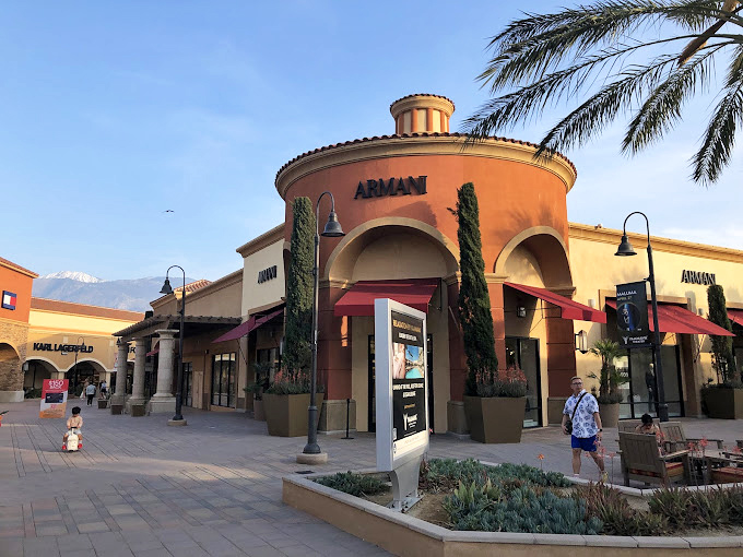 Armani's distinctive circular storefront stands like a temple to Italian design, beckoning fashionistas from the desert landscape.