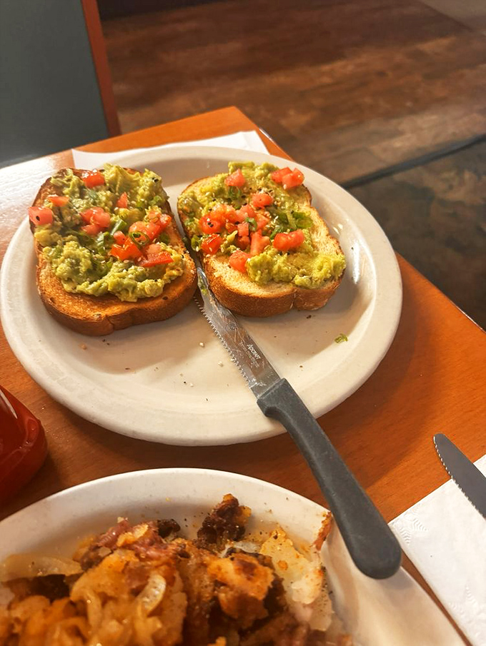Avocado toast that doesn't require a second mortgage. Simple, honest, and topped with diced tomatoes that actually taste like tomatoes.