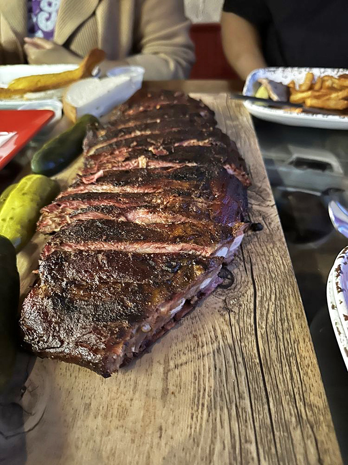 These ribs don't just fall off the bone &ndash; they practically surrender to your fork, offering a perfect balance of smoke, spice, and tenderness.