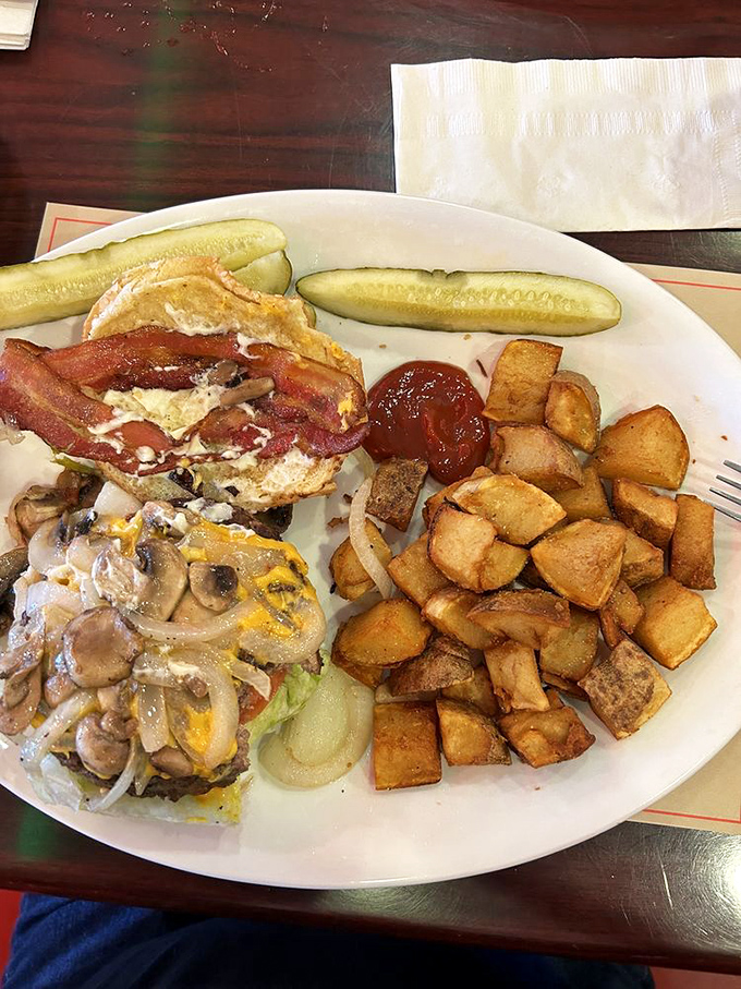 This isn't just a burger&mdash;it's a portable feast complete with crispy bacon, melty cheese, and enough potatoes to feed a small village.