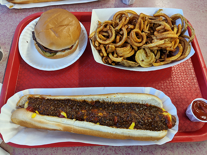 That moment when your burger arrives with an onion ring sentinel standing guard&mdash;as if the sandwich itself wasn't already exciting enough. 