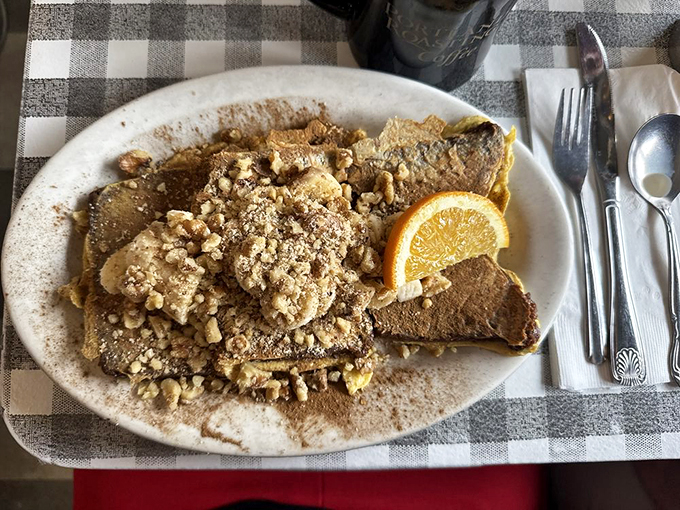 French toast that looks like it was dipped in magic before hitting the griddle, topped with a sprinkle of what can only be described as breakfast joy.