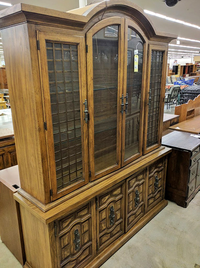 This isn't just a hutch; it's a time machine to Grandma's house, ready to showcase your wedding china or hide holiday gifts from prying eyes.
