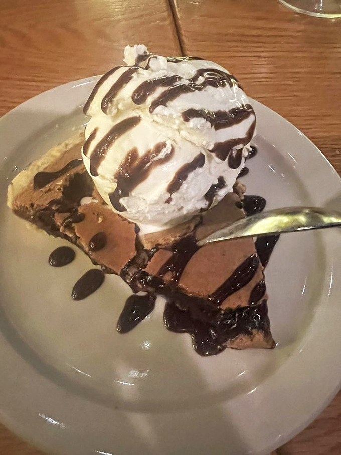 The chocolate filling of this chess pie creates a perfect textural contrast with its crust, while the ice cream slowly melts into sugary poetry.