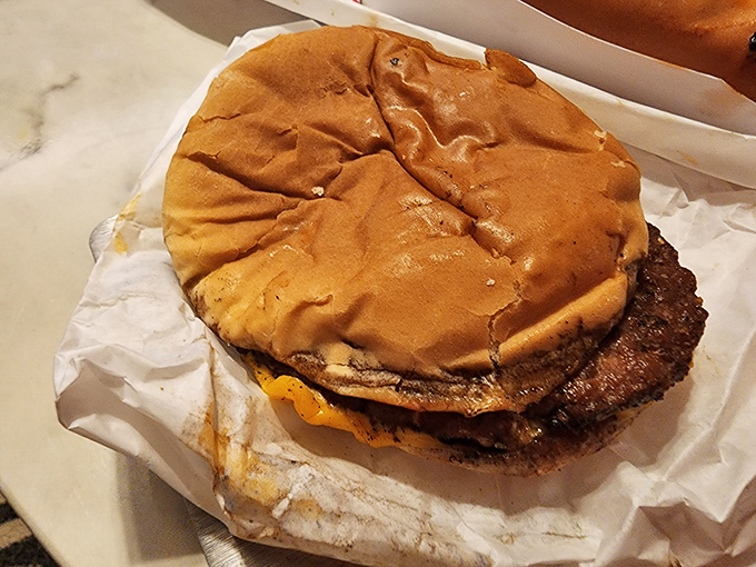 This isn't just a burger&mdash;it's edible evidence that simplicity trumps pretension every time. That char on the patty speaks volumes about proper grilling.